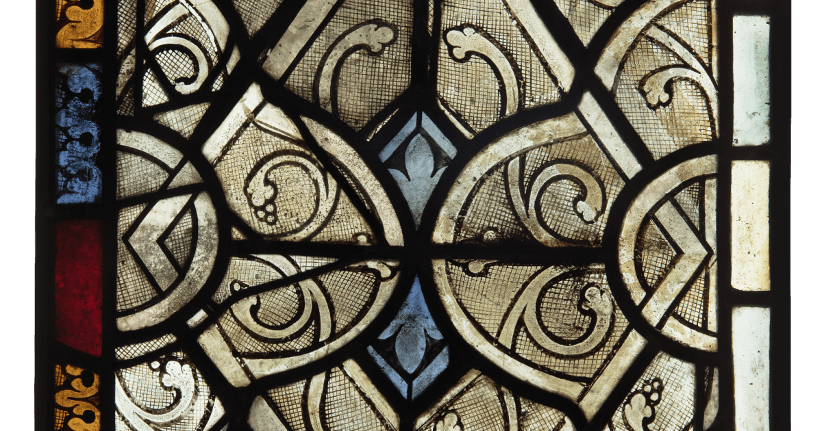 A large window panel painted with scrolling vine work in grisaille, c ...