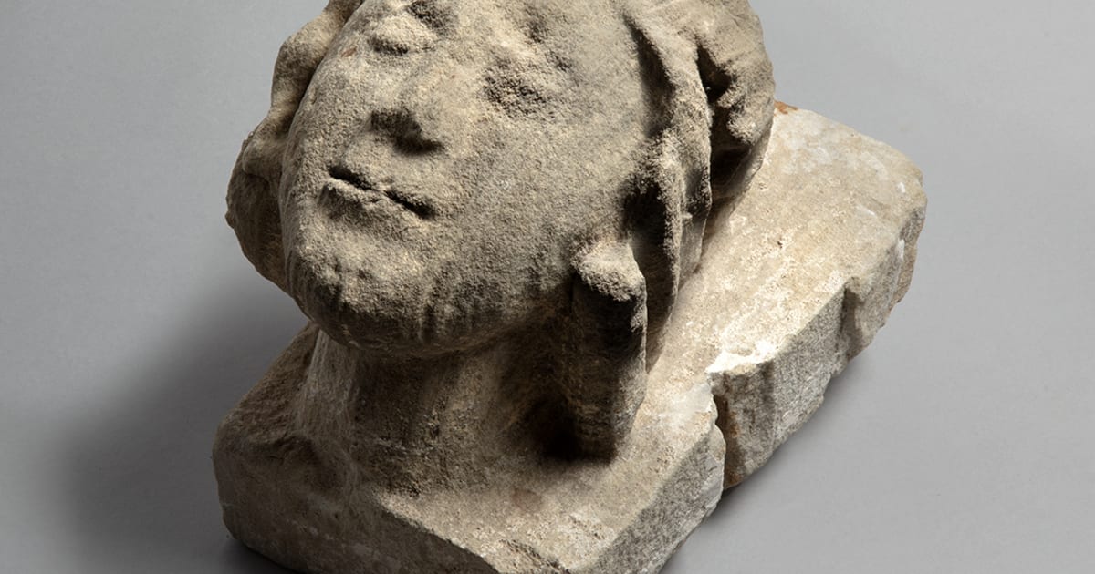 A sandstone label stop carved with the head of a king, c. 1300 | Sam Fogg