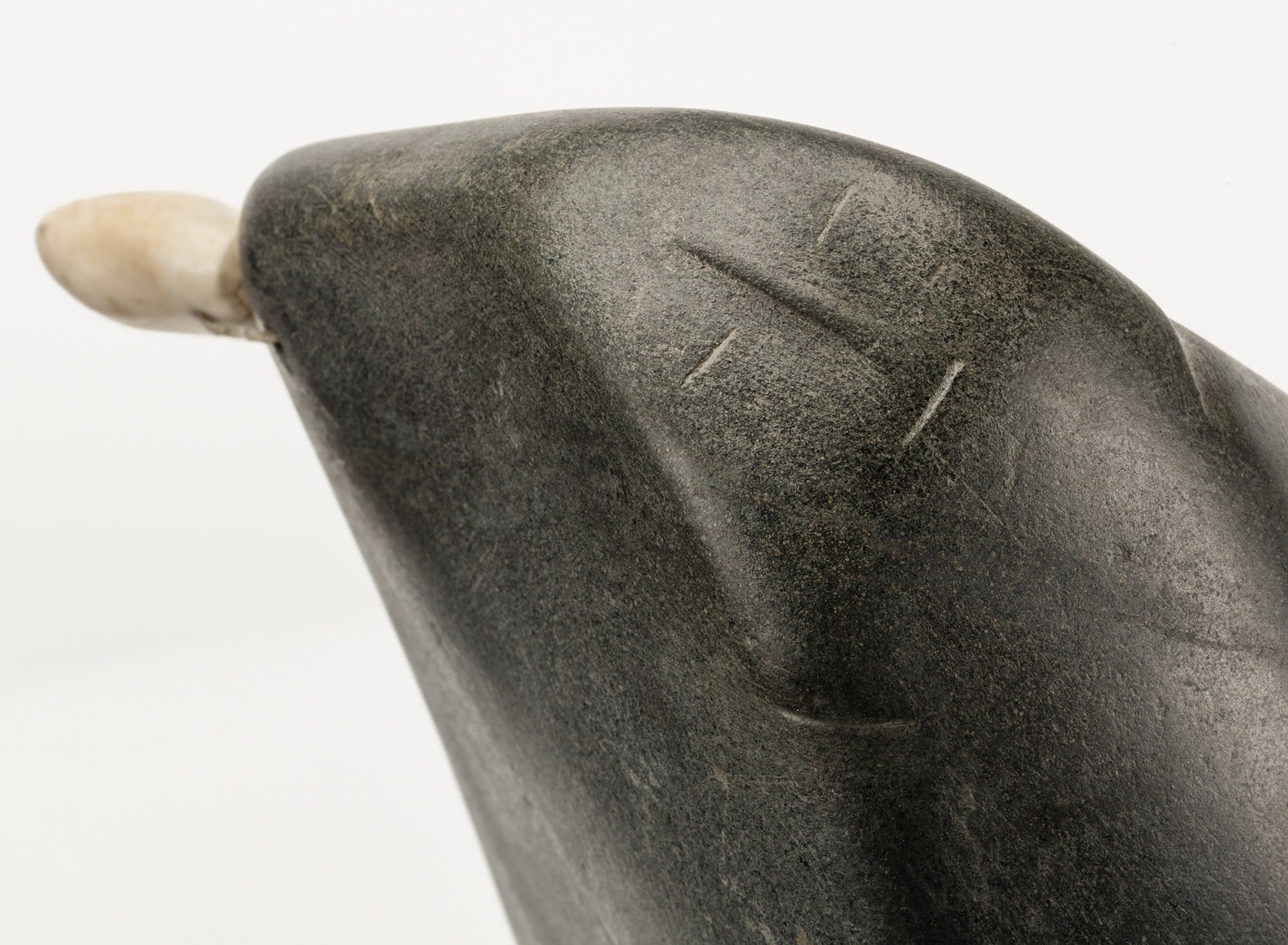 JOHN PANGNARK (1920-1980) ARVIAT (ESKIMO POINT), Figure with Amulet, c ...