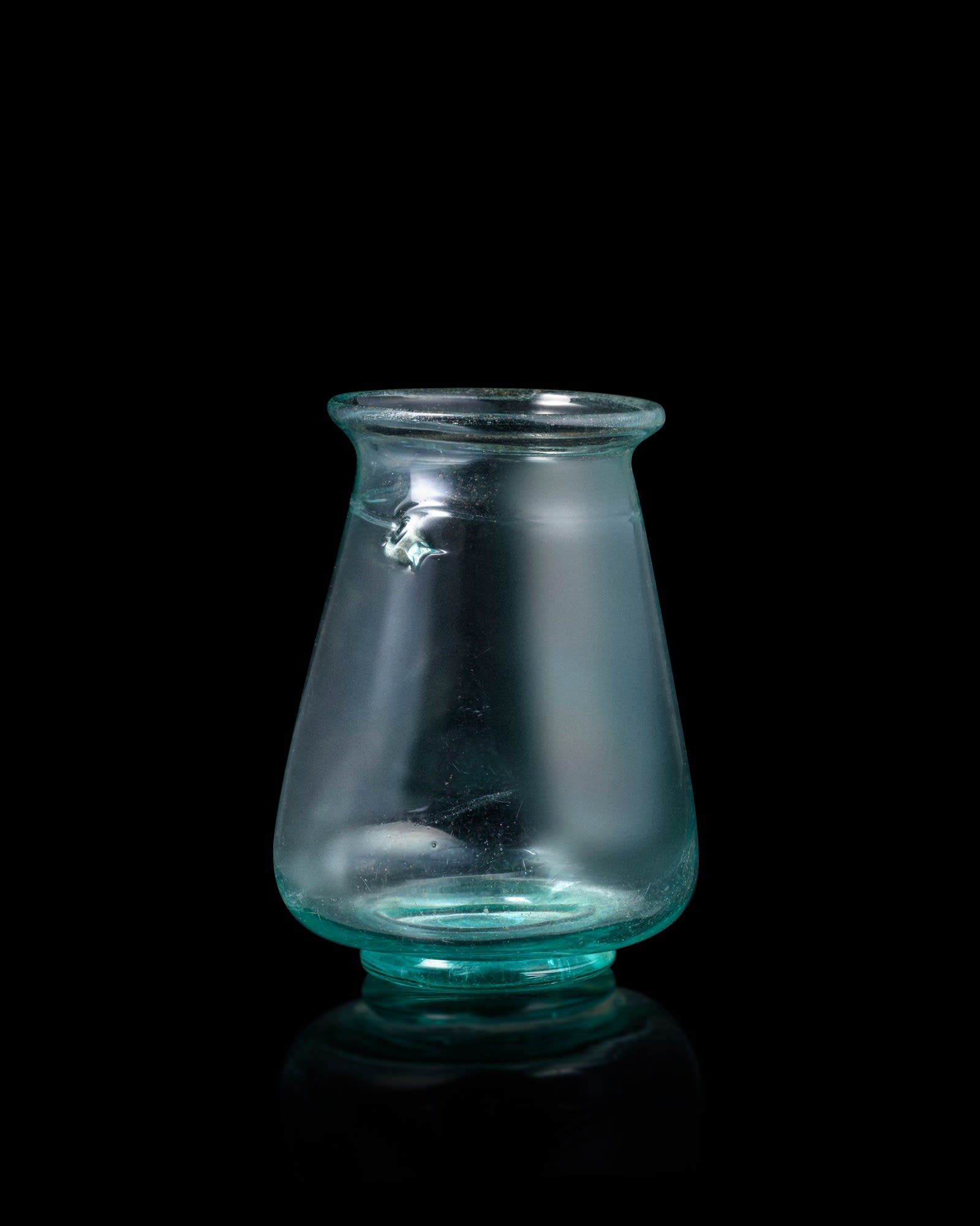 Roman, A Roman blue-green conical glass beaker, circa 3rd Century AD ...