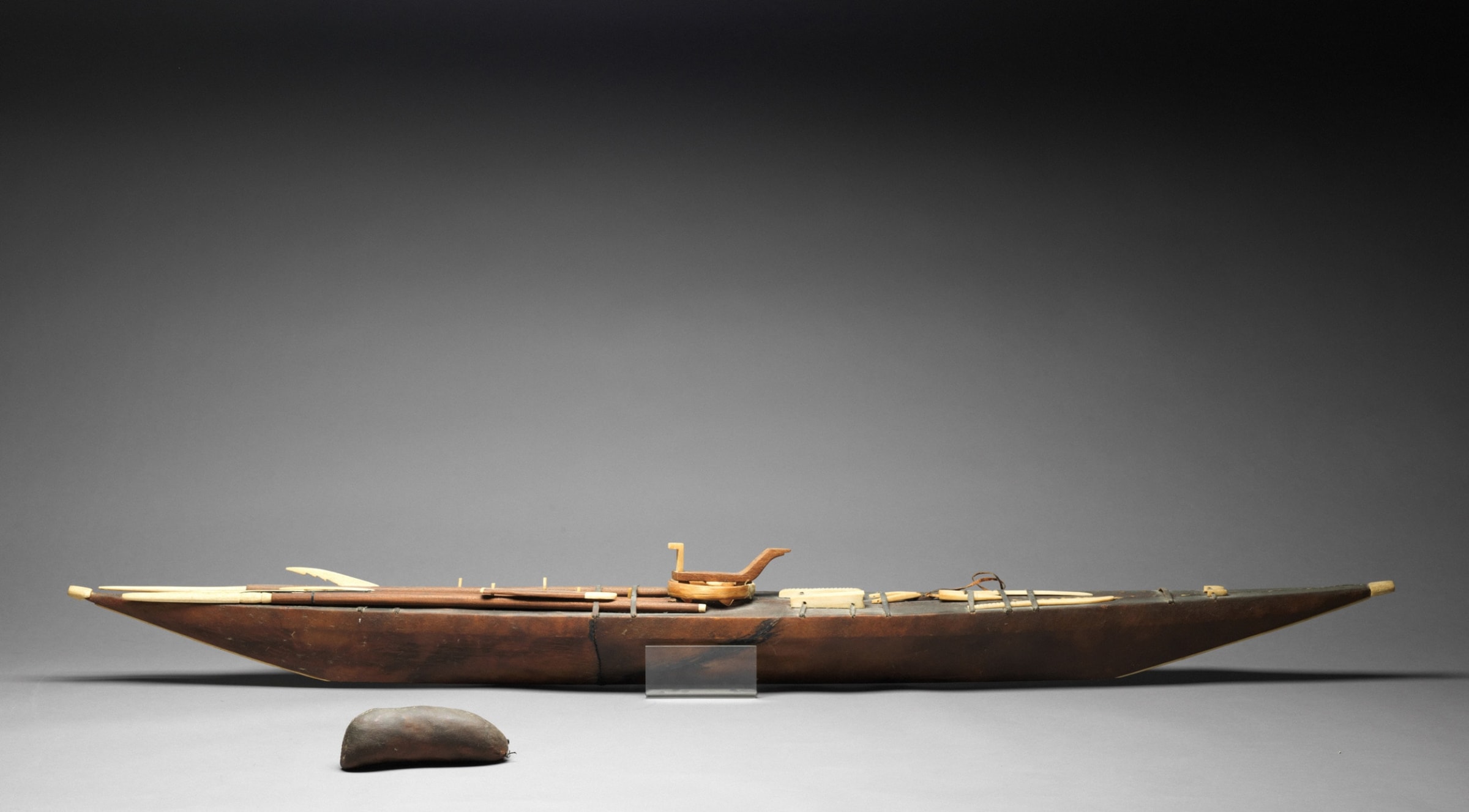 Inuit Model Kayak.Wooden frame covered with seal skin, lined with bone ...