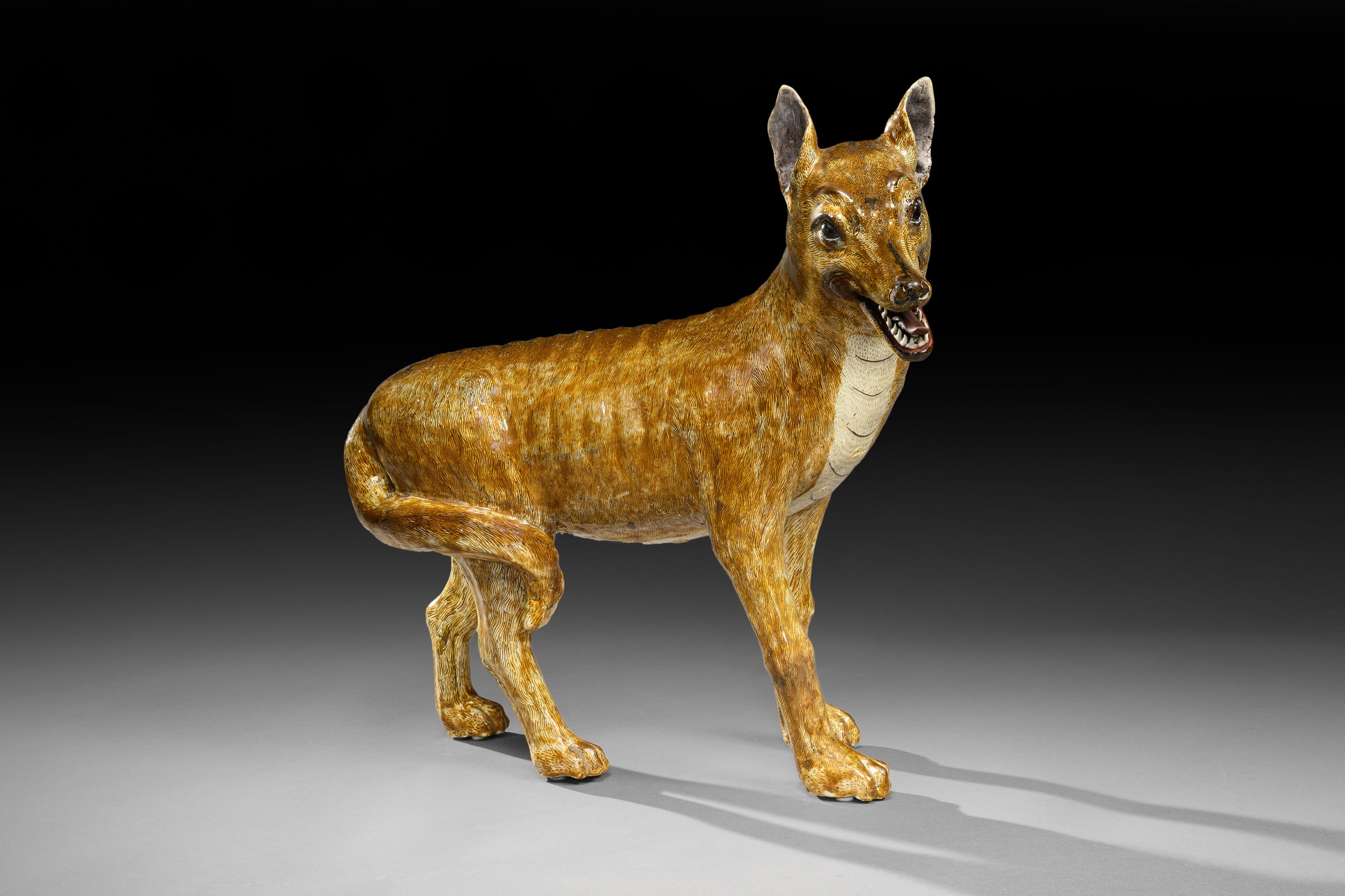 AN ENAMELLED PORCELAIN MODEL OF A WOLF, Qing Dynasty, Qianlong Period ...